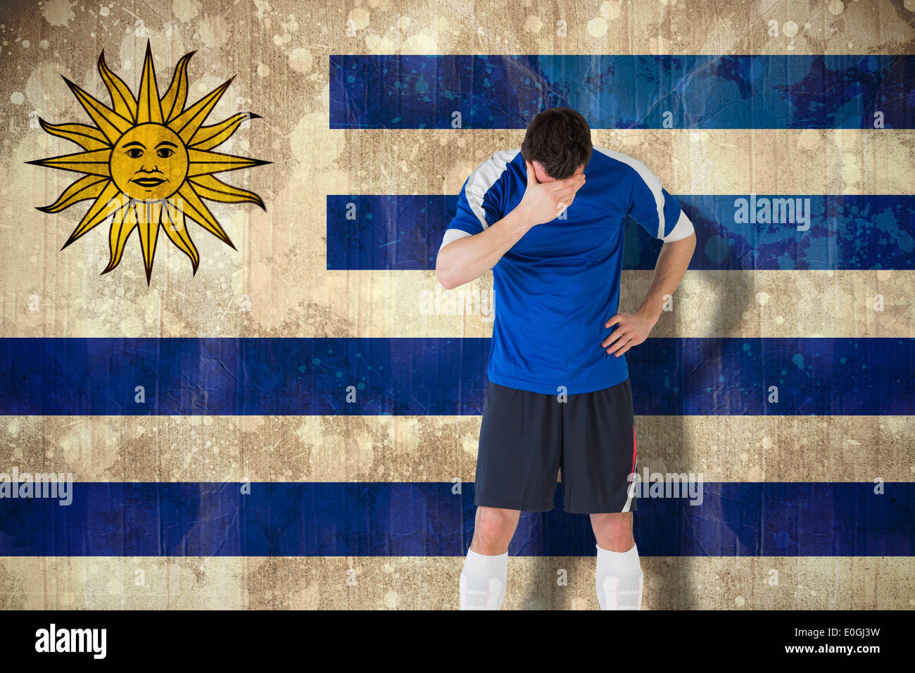 Disappointed football player looking down Stock Photo - Alamy