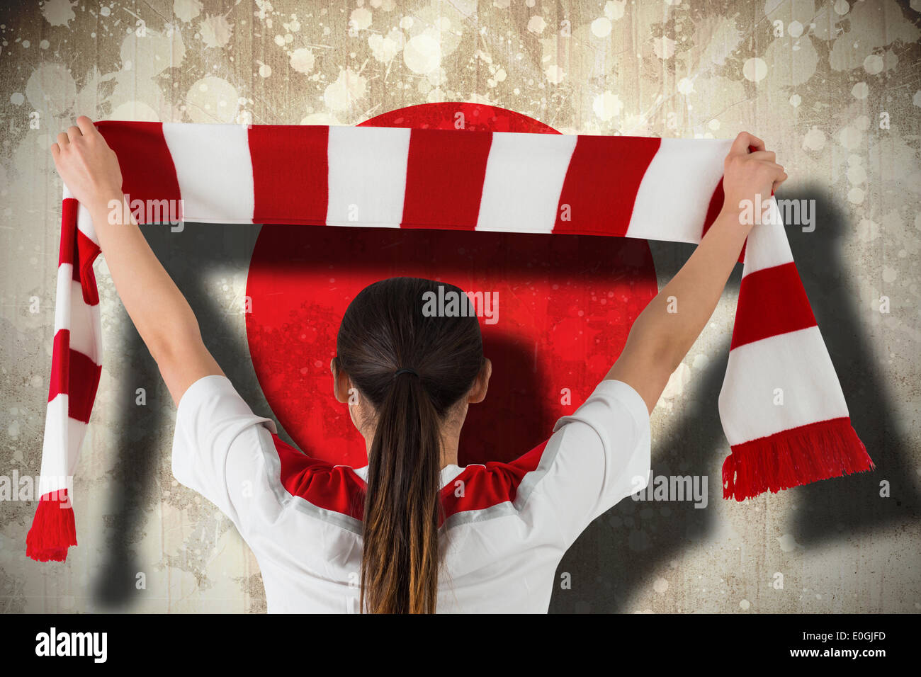 Football fan waving red and white scarf Stock Photo - Alamy