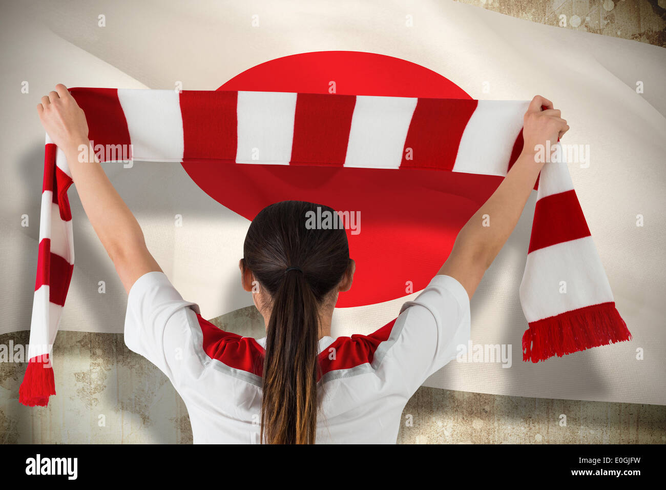 Football fan waving red and white scarf Stock Photo - Alamy