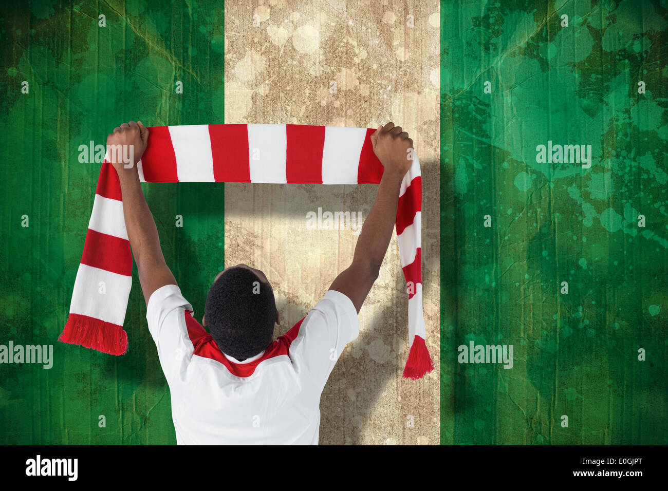 Happy football fan waving scarf Stock Photo - Alamy