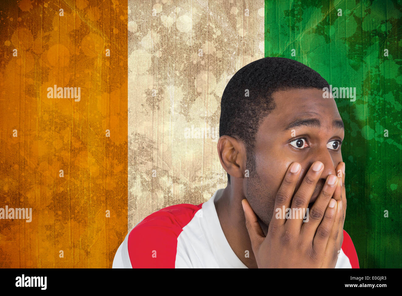 Nervous football fan looking ahead Stock Photo - Alamy