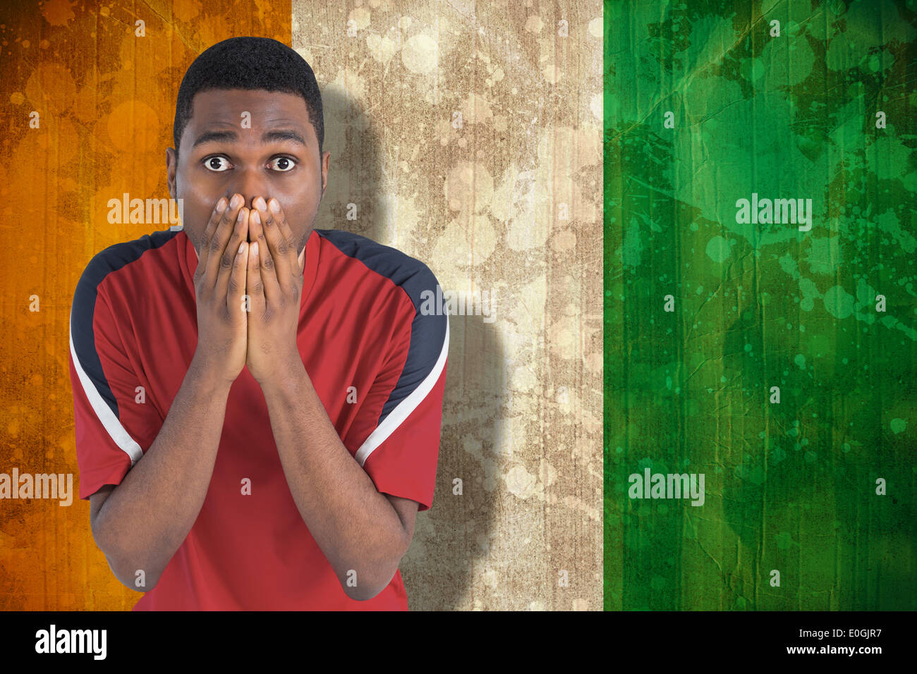 Nervous football fan looking ahead Stock Photo - Alamy