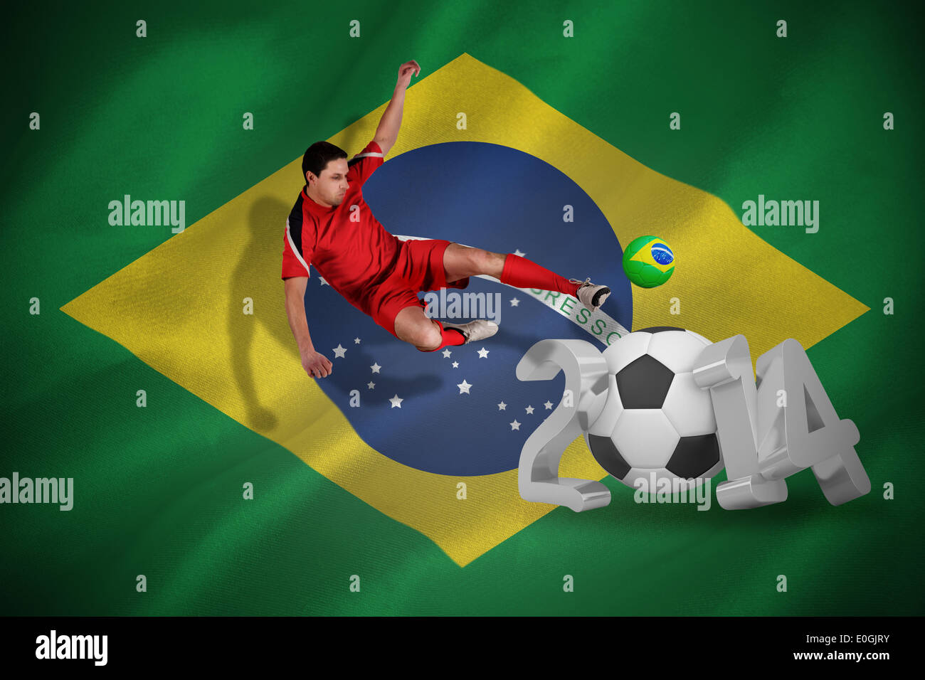 Fit football player jumping and kicking Stock Photo - Alamy