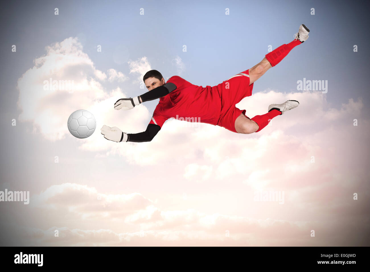 Fit goal keeper jumping up Stock Photo - Alamy