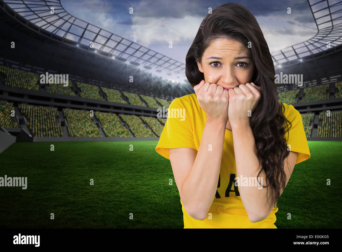 Nervous football fan in brasil tshirt Stock Photo - Alamy
