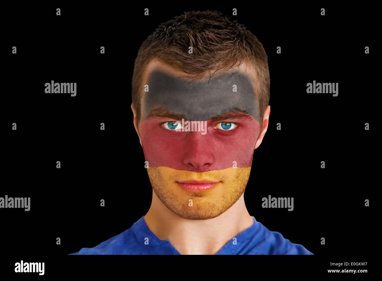 Serious young germany fan with facepaint Stock Photo - Alamy