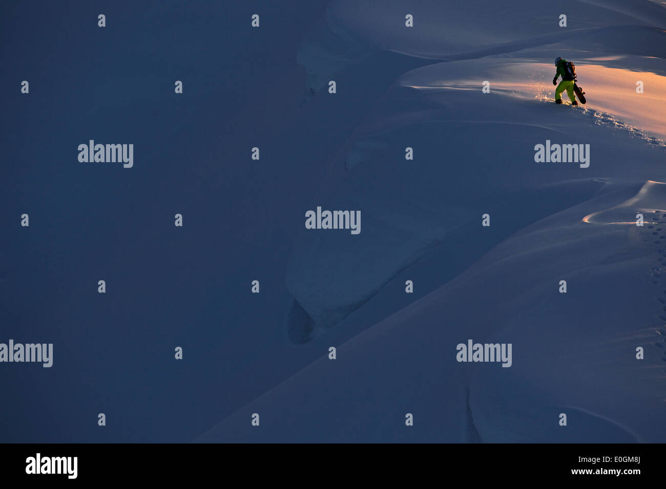 Man snowboarding through deep powder sports hi-res stock photography ...