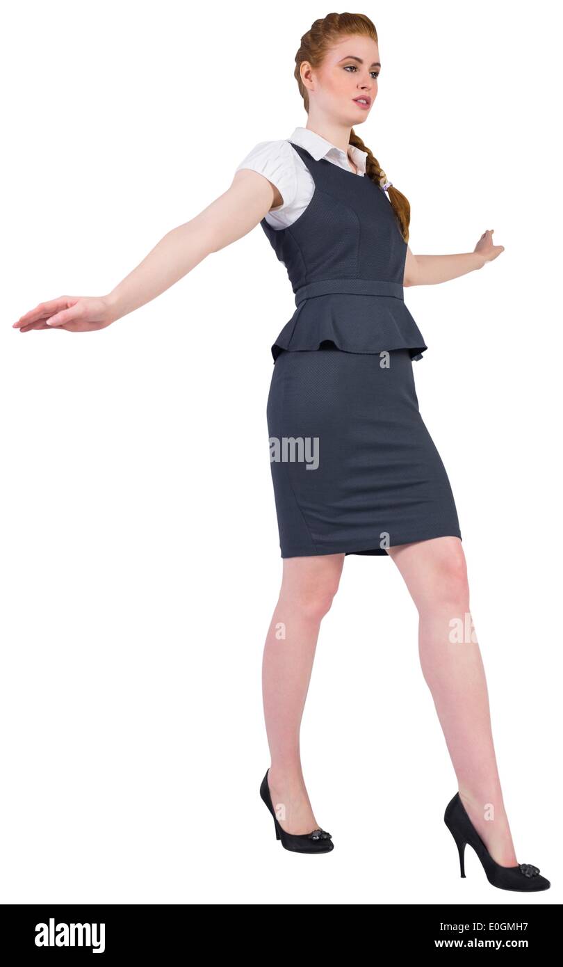 Businesswoman doing a balancing act Stock Photo - Alamy