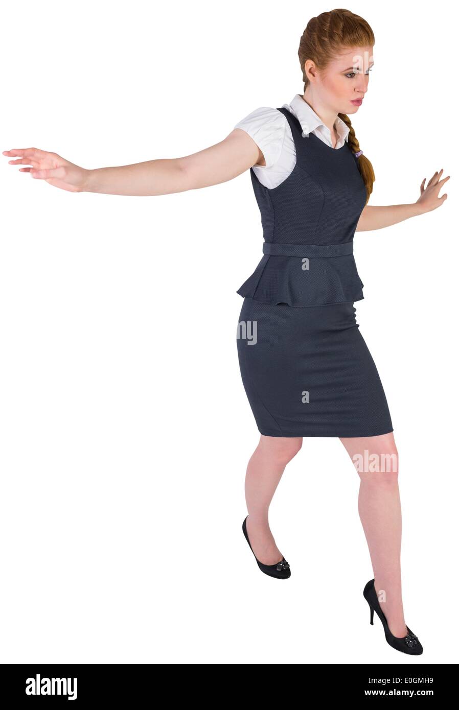 Businesswoman doing a balancing act Stock Photo - Alamy