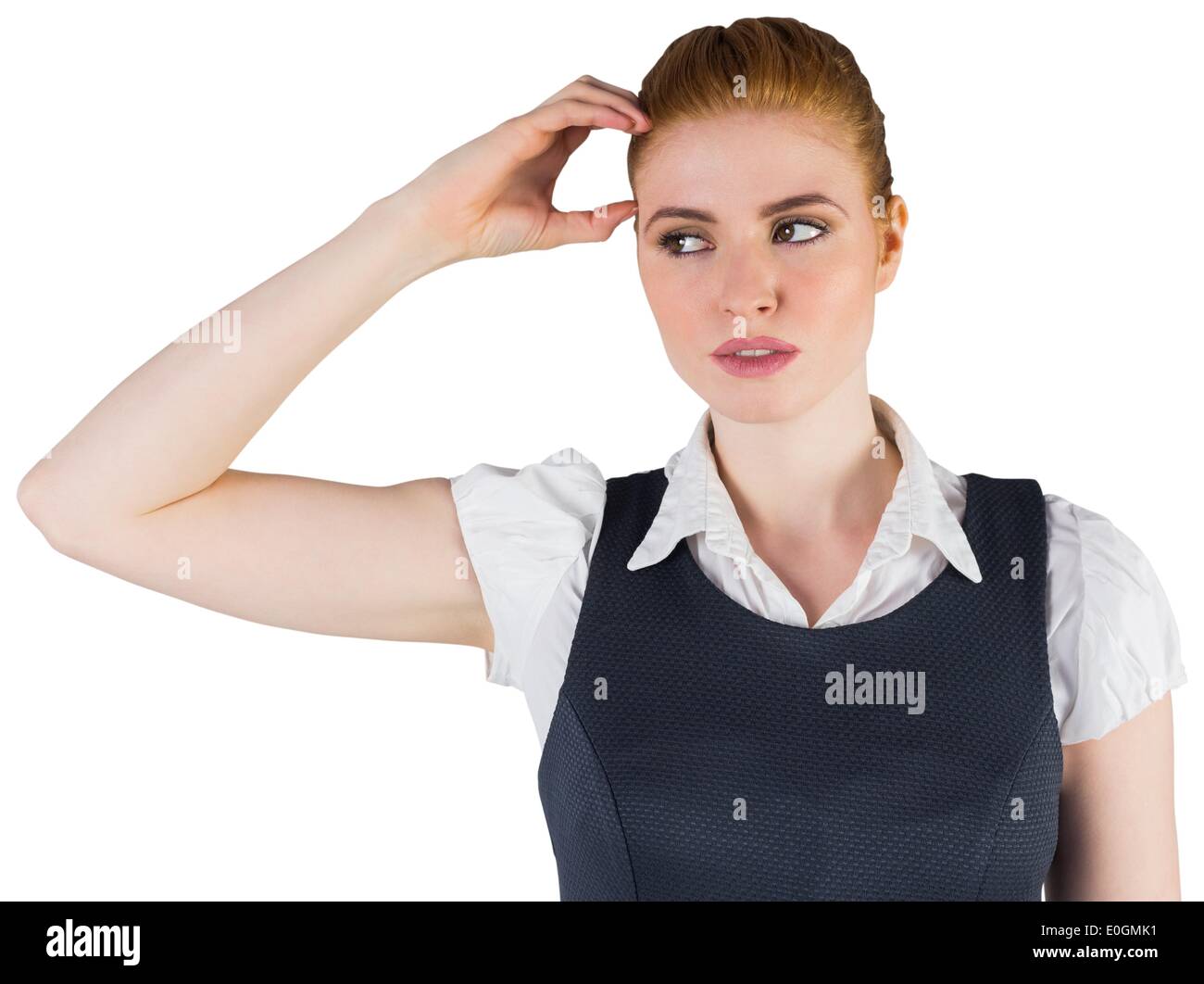 Thinking redhead businesswoman scratching head Stock Photo - Alamy