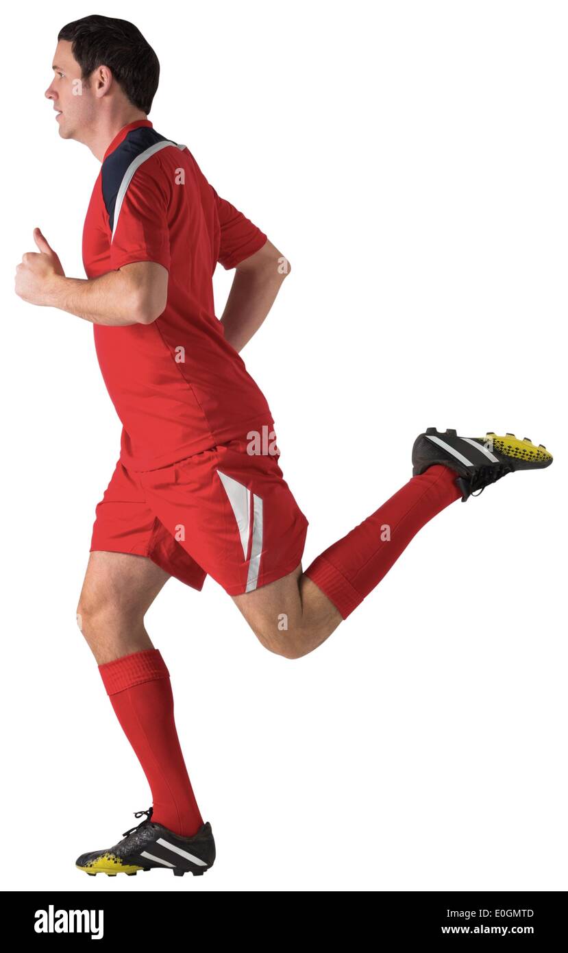 Football player in red running Stock Photo - Alamy