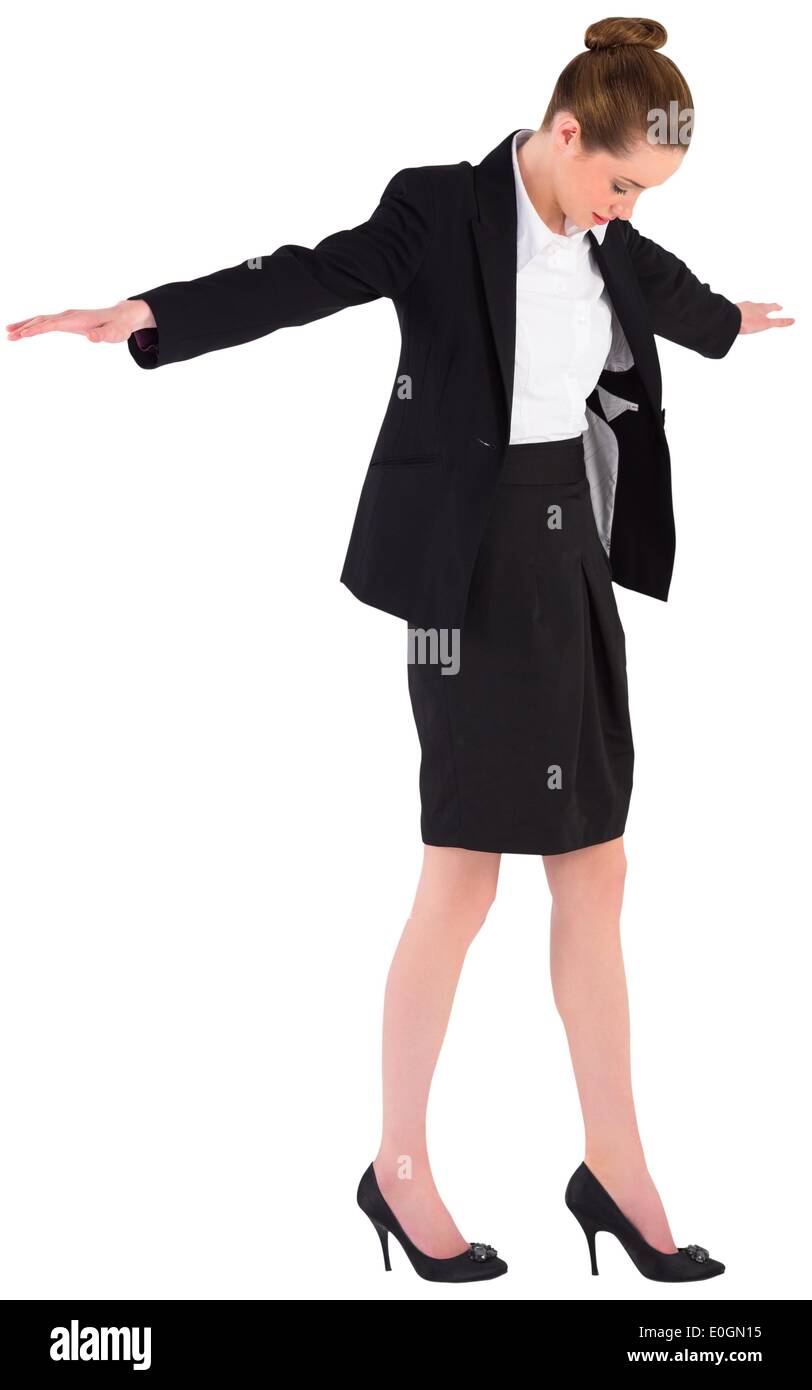 Businesswoman performing a balancing act Stock Photo - Alamy