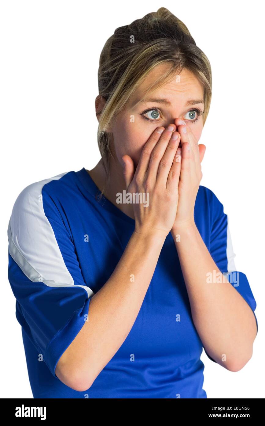 Nervous football fan in blue jersey Stock Photo - Alamy
