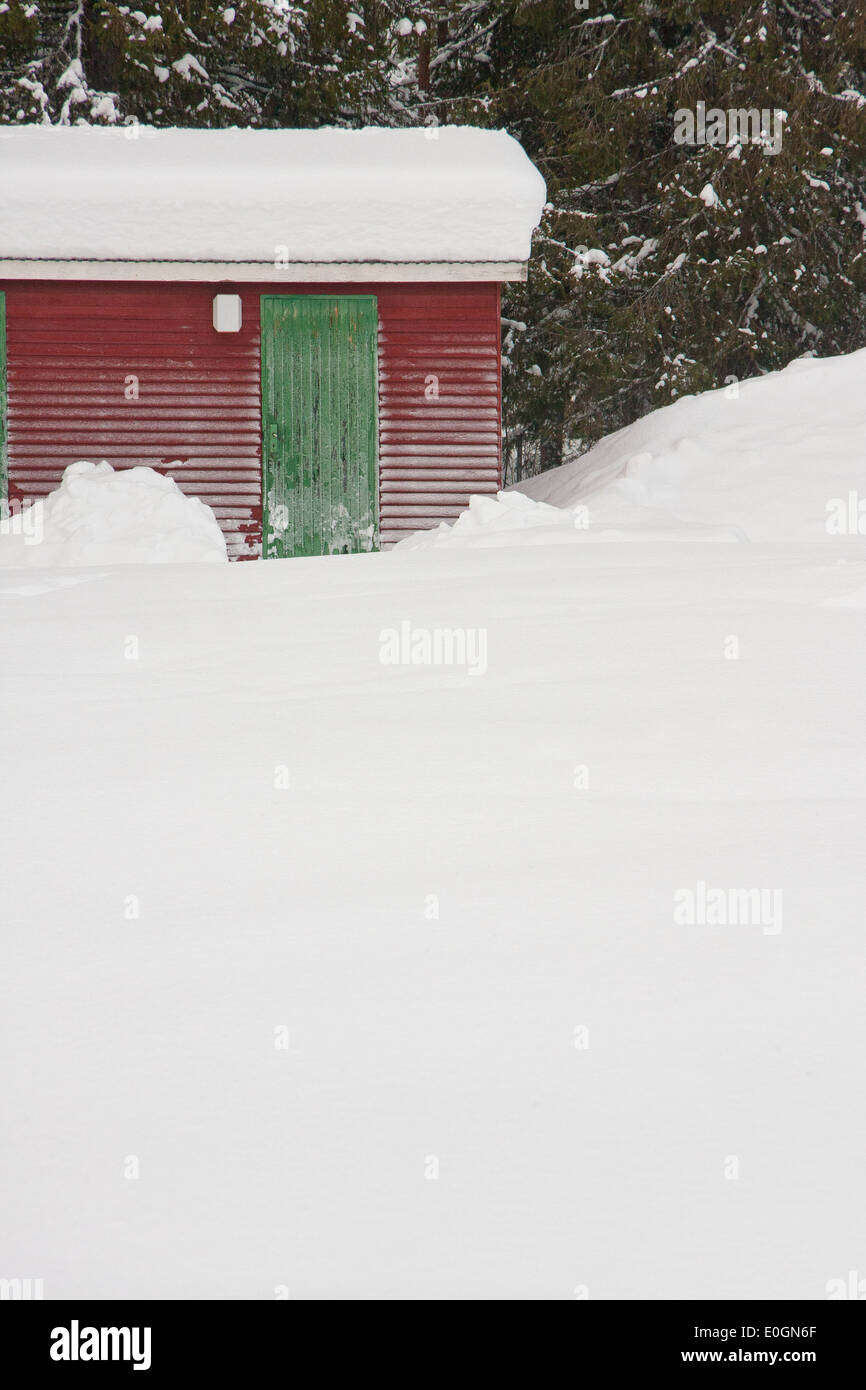 Snow filled pathway leading to cabin in the woods at the Ice Hotel in ...