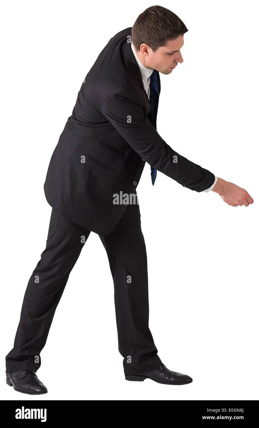 Handsome businessman pulling with hand Stock Photo - Alamy
