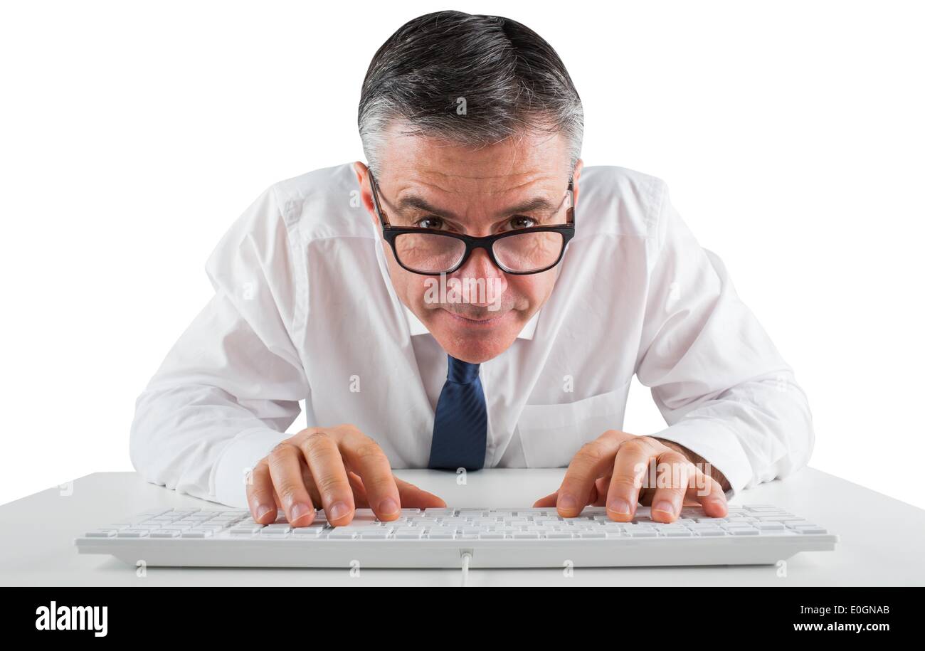 Mature businessman typing on keyboard Stock Photo - Alamy