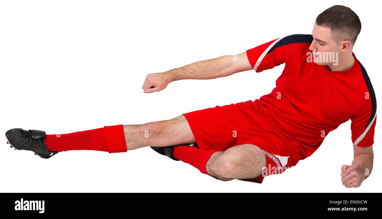 Fit football player playing and kicking Stock Photo - Alamy