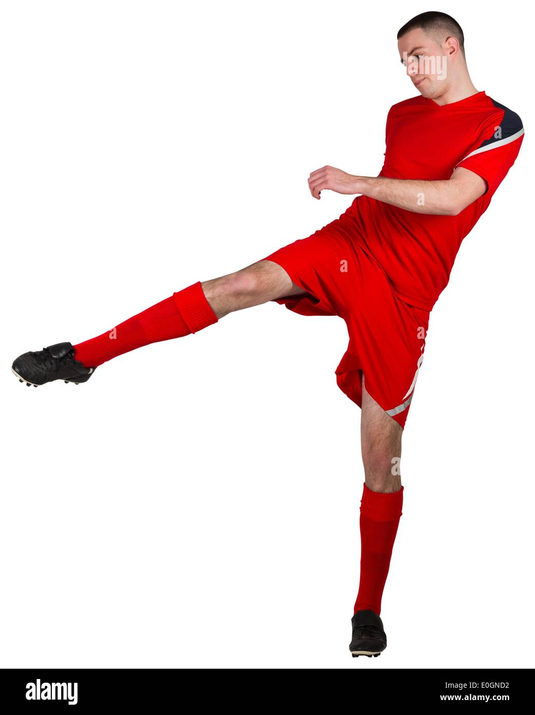 Fit football player playing and kicking Stock Photo - Alamy