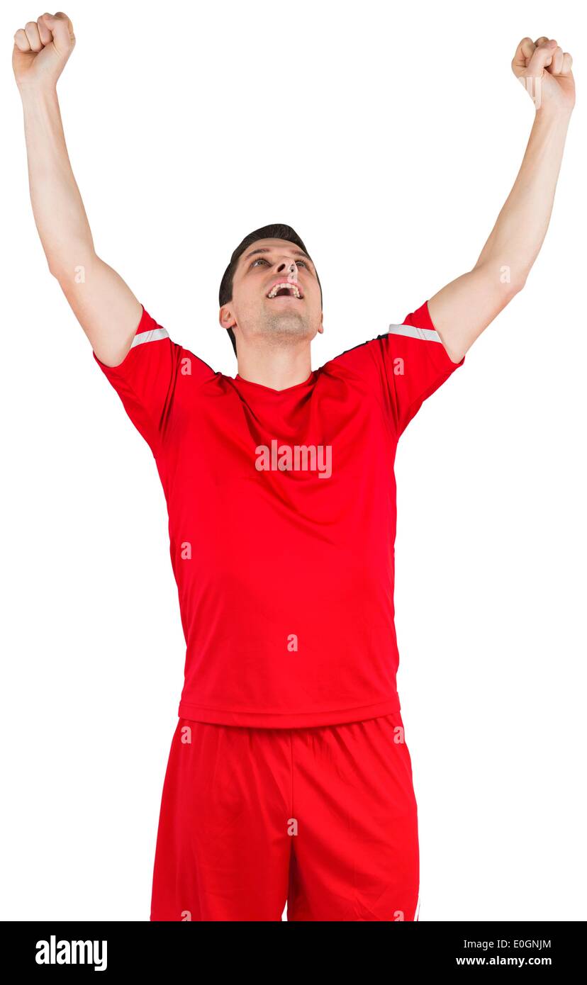Excited young football player cheering Stock Photo - Alamy