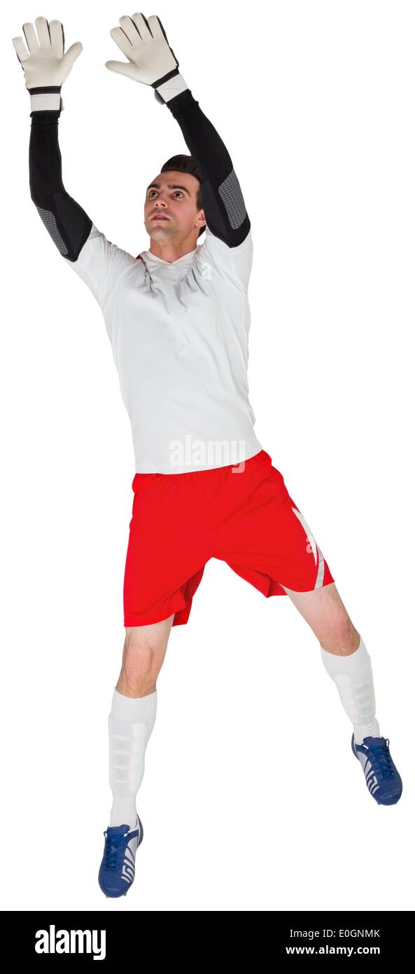 Goalkeeper in white making a save Stock Photo - Alamy