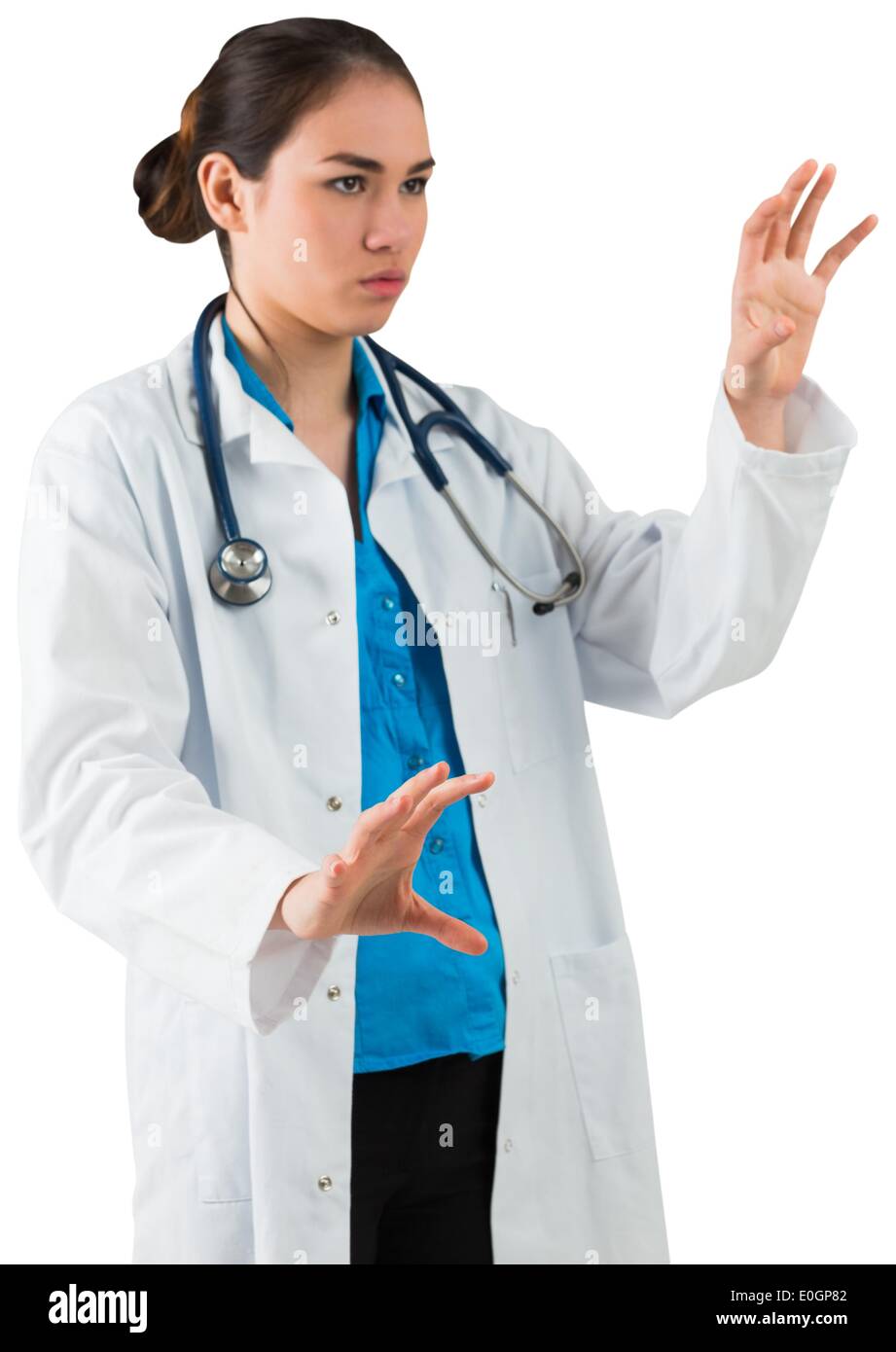 Young doctor standing with hands up Stock Photo - Alamy