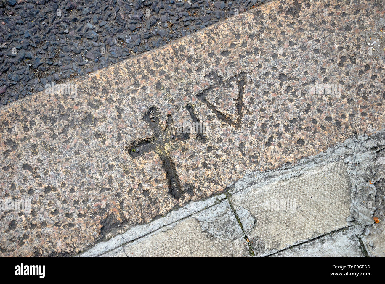 London, England, UK. Stonemason's marks on curbstones in Serle Street ...