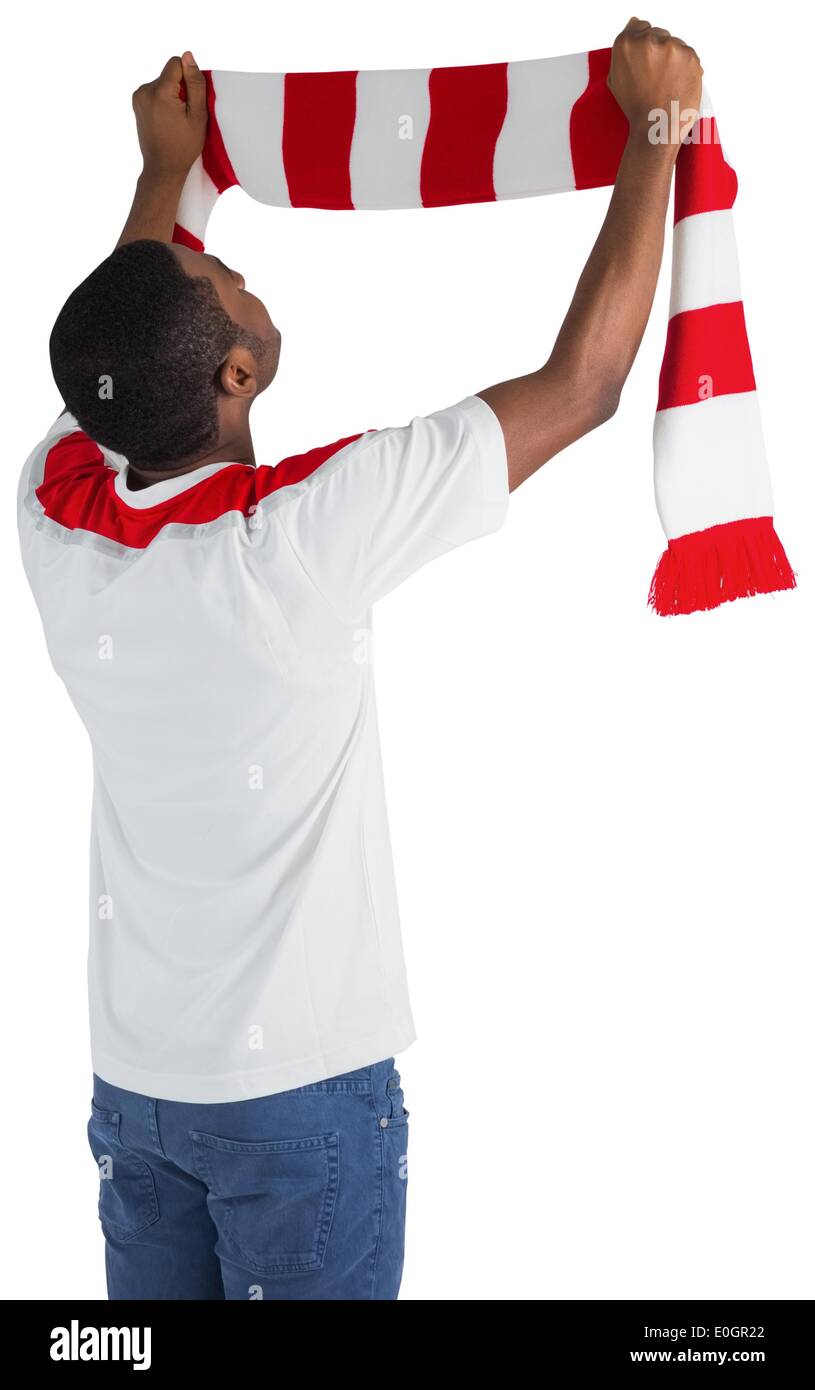 Happy football fan waving scarf Stock Photo - Alamy