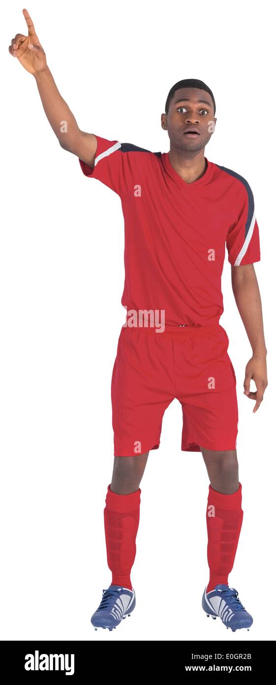 Football player in red raising his hand Stock Photo - Alamy