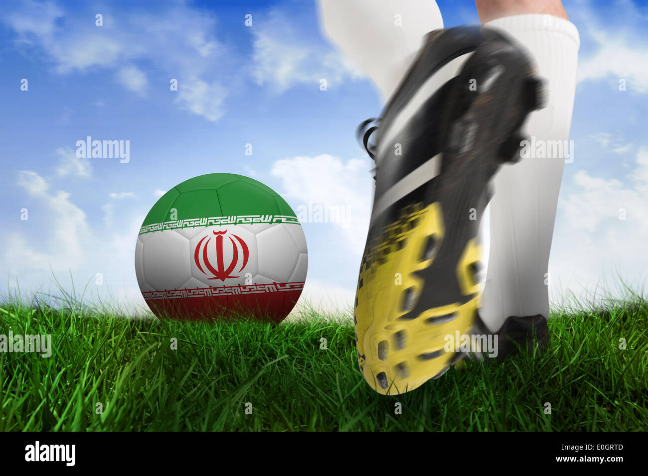 Football boot kicking iran ball Stock Photo - Alamy
