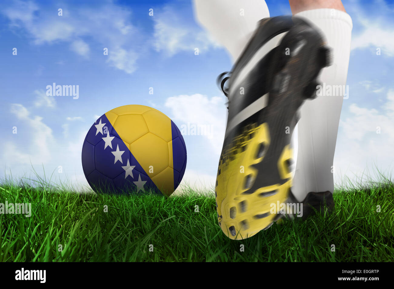 Football boot kicking bosnia ball Stock Photo - Alamy