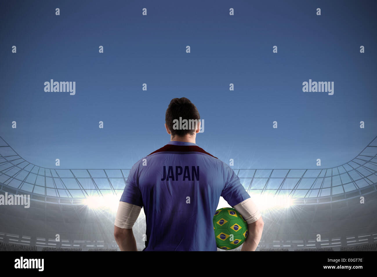 Japan football player holding ball Stock Photo - Alamy
