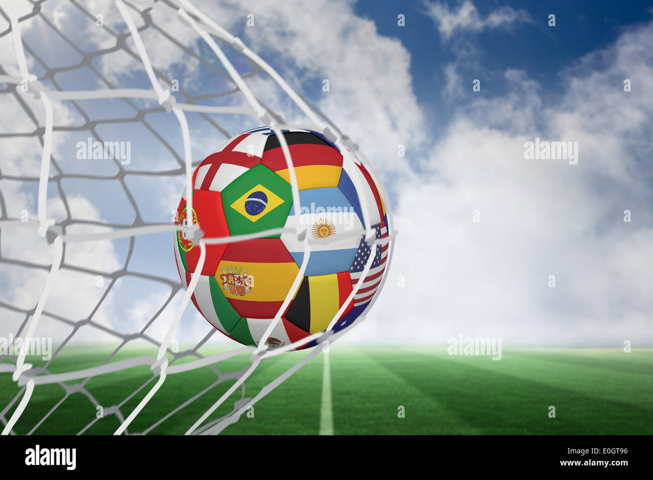 Football in multi national colours at back of net Stock Photo - Alamy