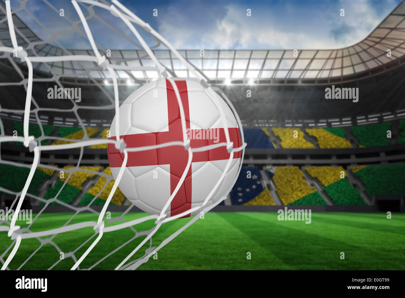 Football in england colours at back of net Stock Photo - Alamy