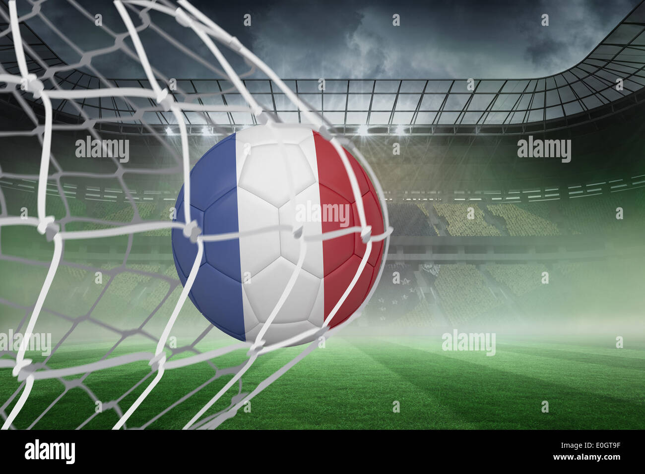 Football in france colours at back of net Stock Photo - Alamy