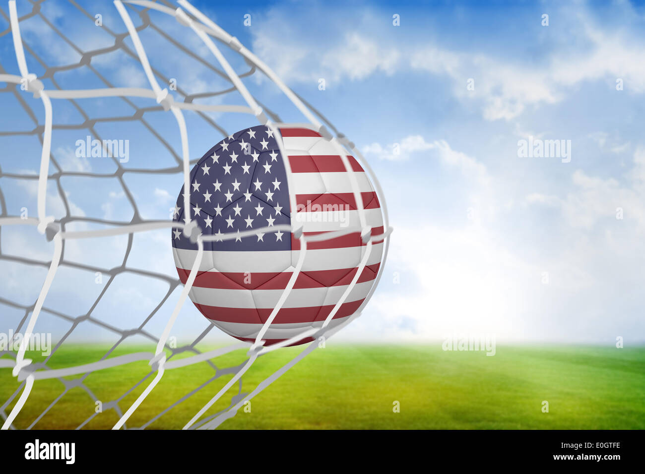 Football in america colours at back of net Stock Photo - Alamy