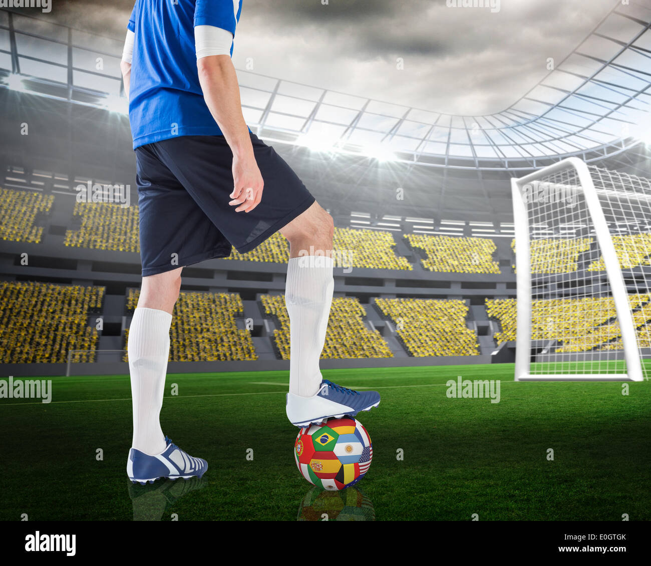 Football player standing with international ball Stock Photo - Alamy
