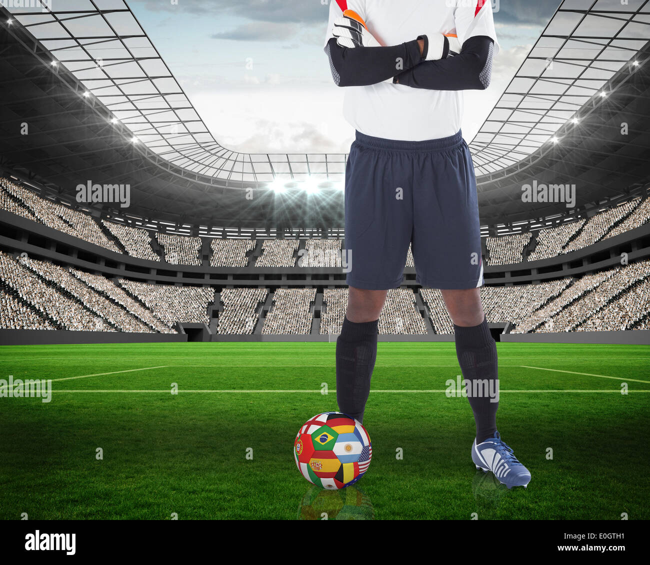 Goalkeeper standing with international ball Stock Photo - Alamy