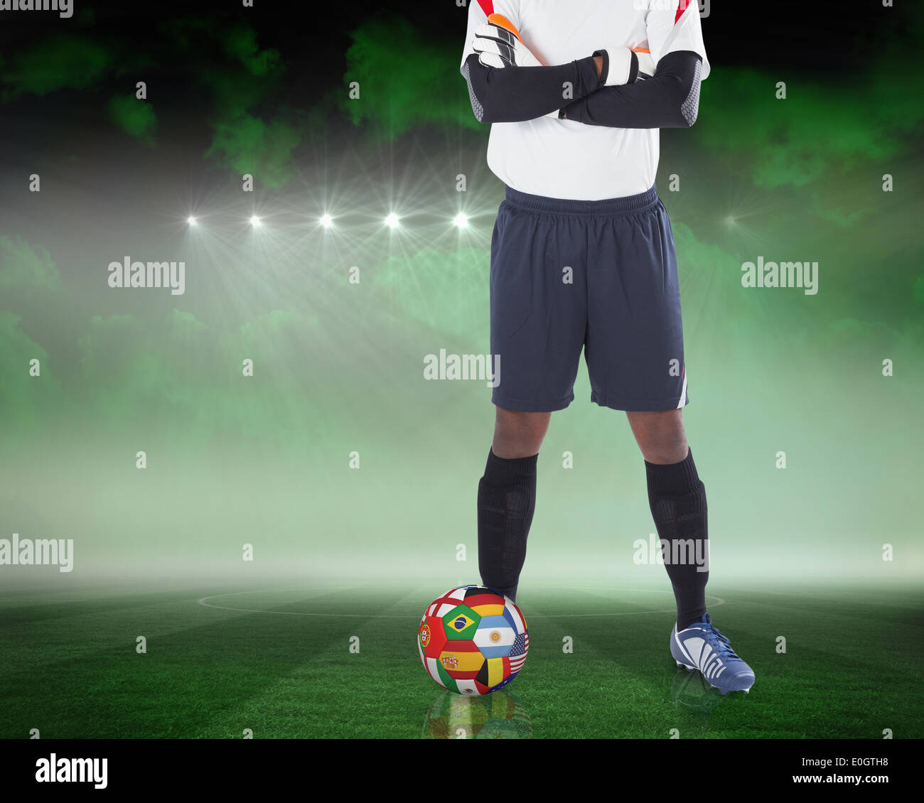 Goalkeeper standing with international ball Stock Photo - Alamy
