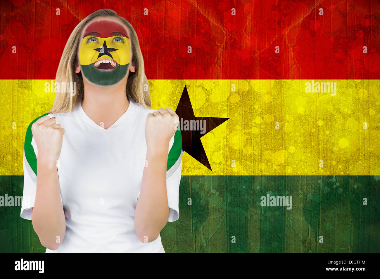Excited ghana fan in face paint cheering Stock Photo - Alamy