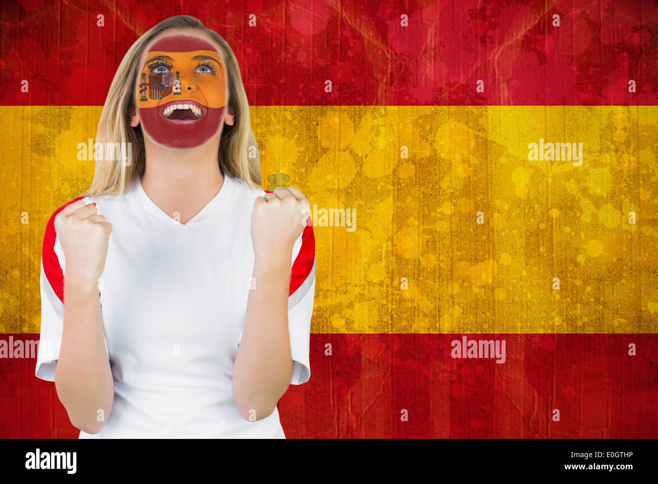 Excited spain fan in face paint cheering Stock Photo - Alamy
