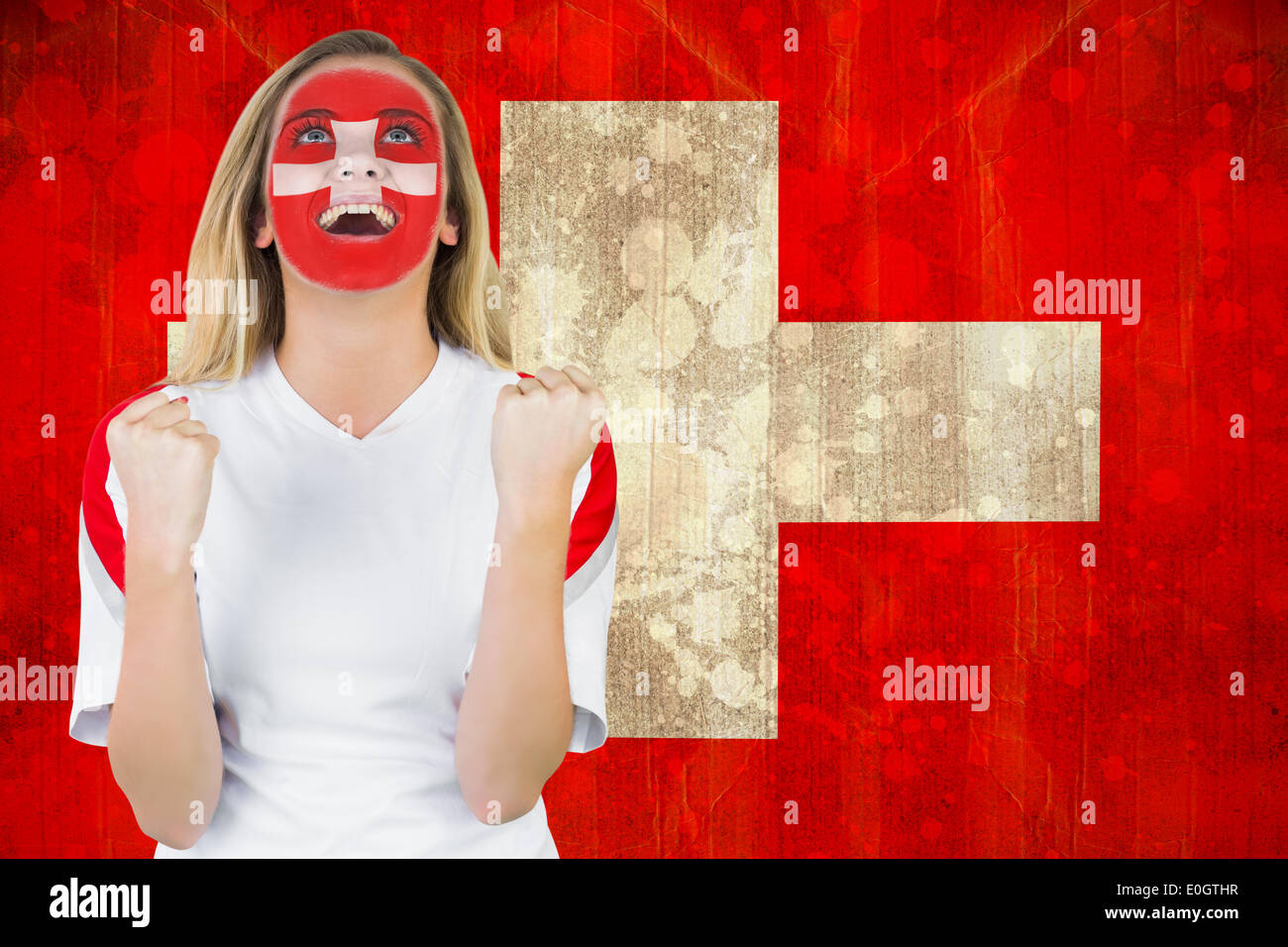 Excited fan in swiss face paint cheering Stock Photo - Alamy