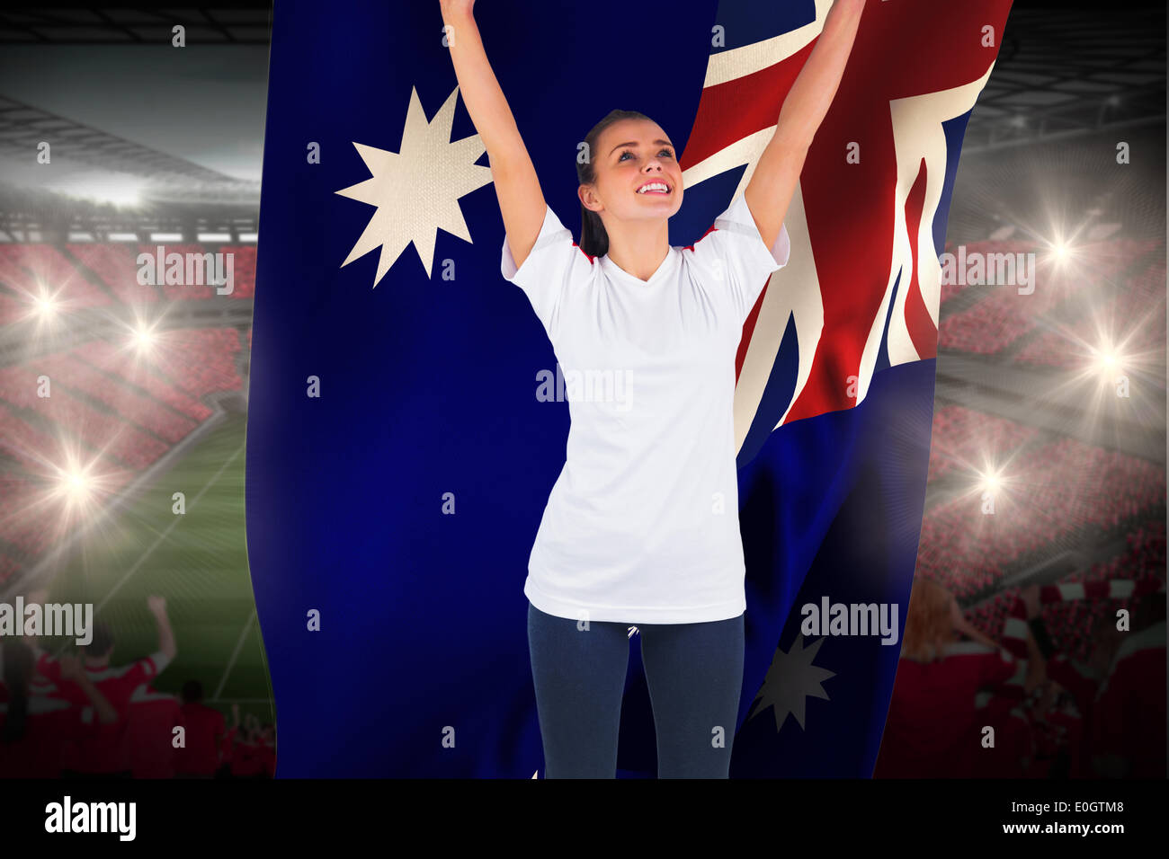 Excited football fan in white cheering holding australia flag Stock ...