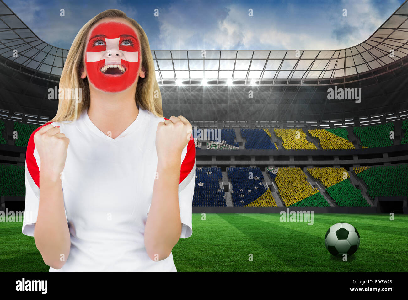 Excited fan in swiss face paint cheering Stock Photo - Alamy