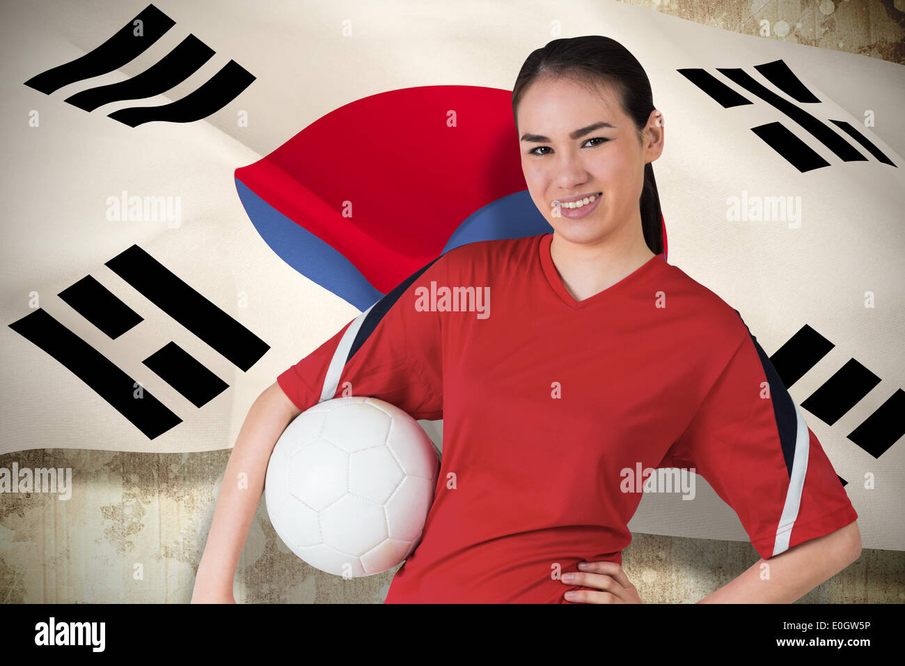 Smiling asian football fan looking at camera Stock Photo - Alamy