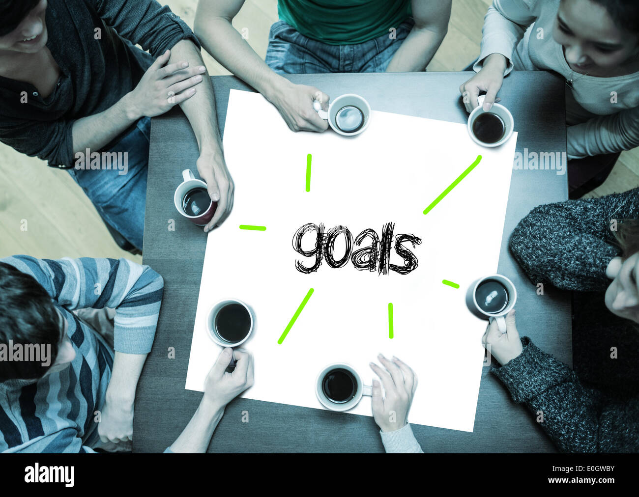 Goals on page with people sitting around table drinking coffee Stock ...