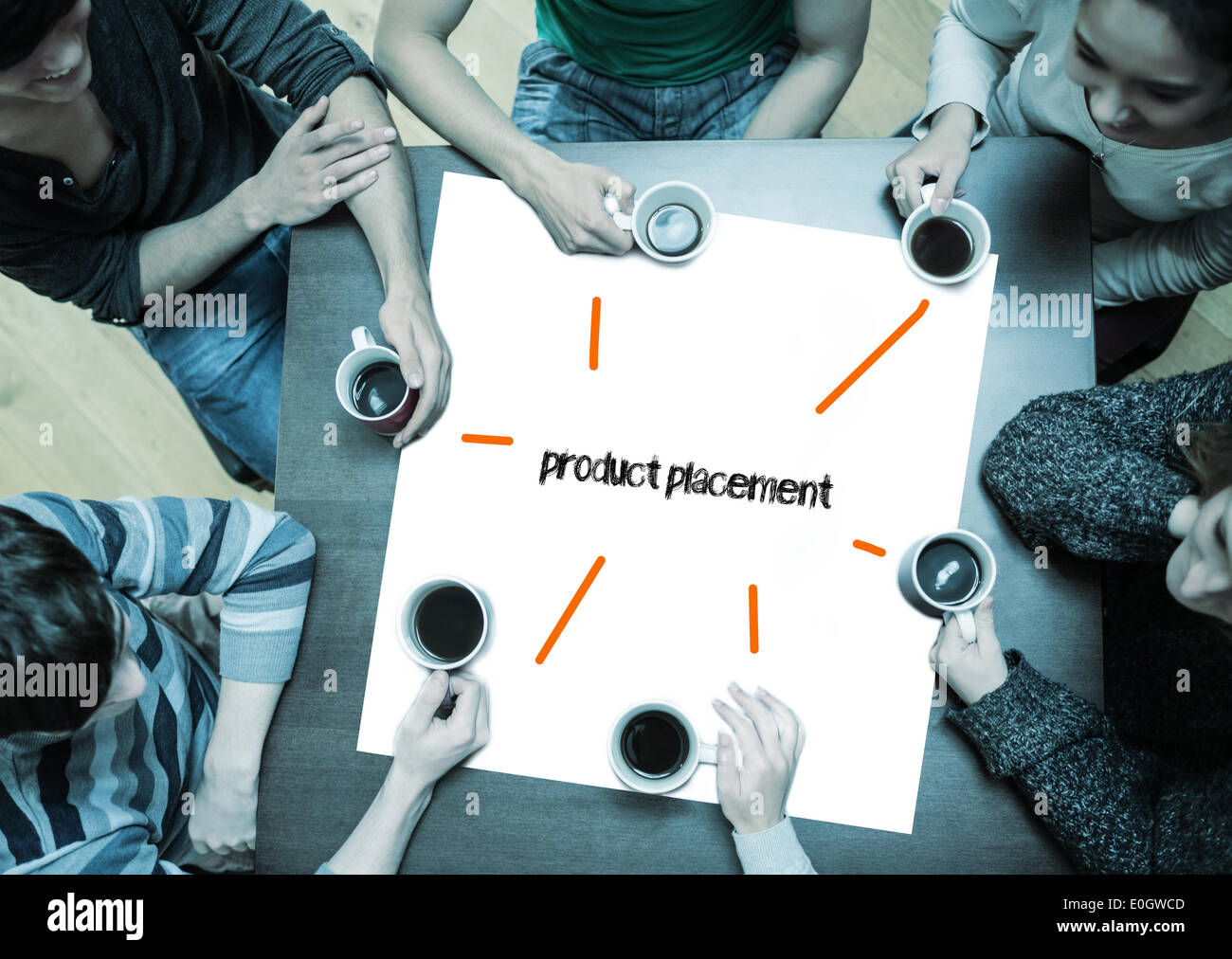 Product placement on page with people sitting around table drinking ...
