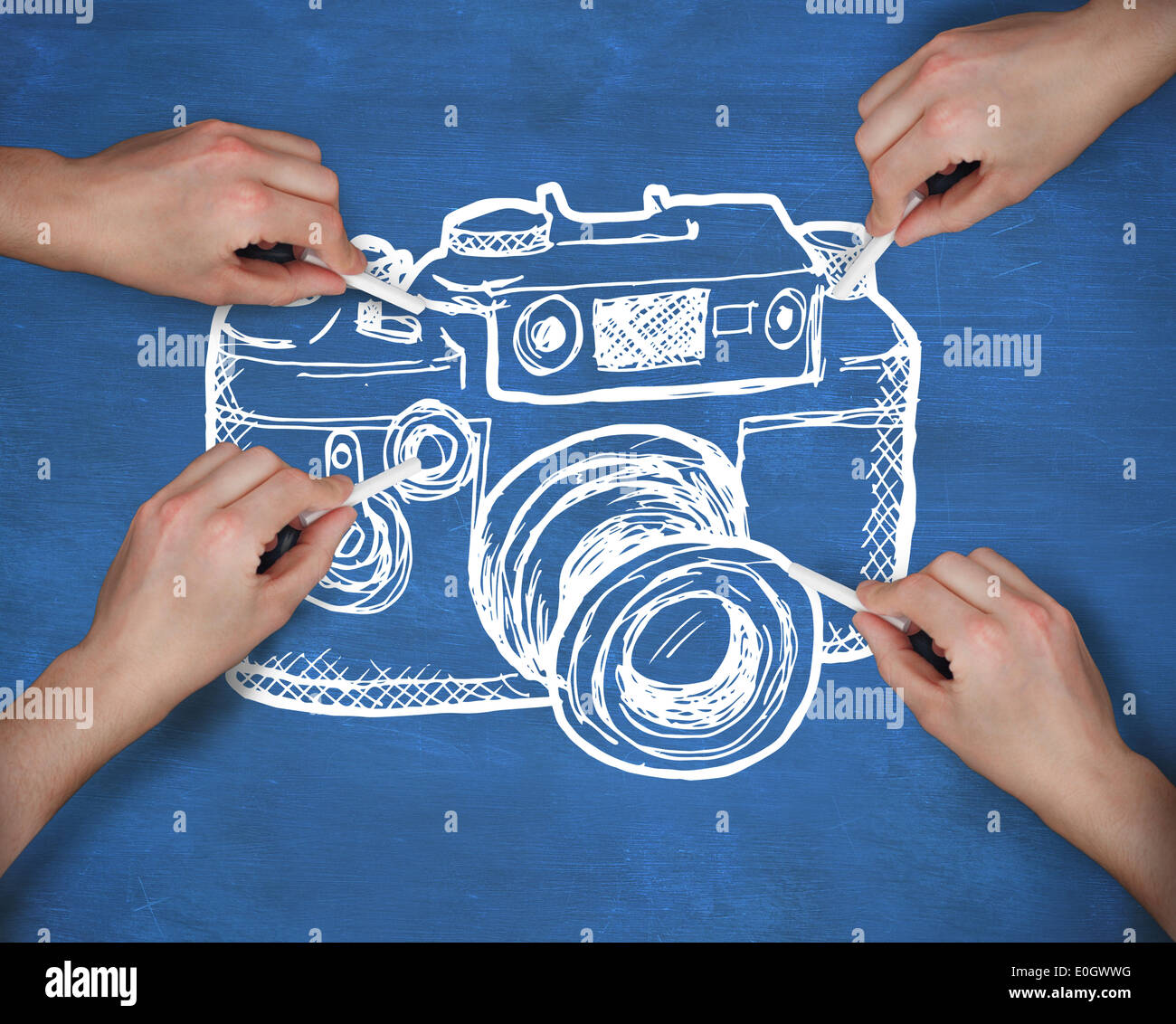 Composite image of multiple hands drawing camera with chalk Stock Photo ...
