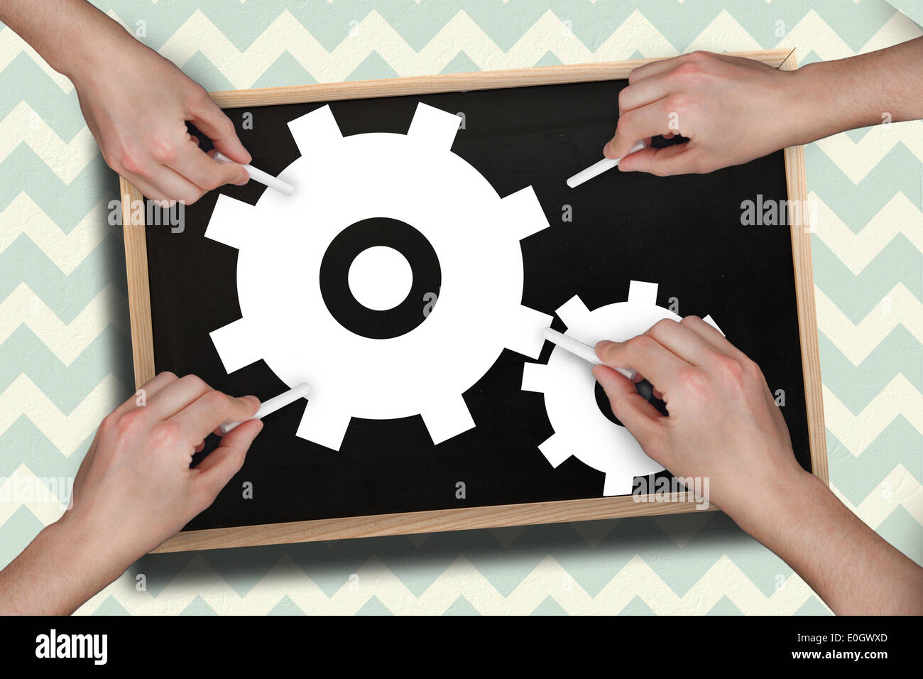 Composite image of multiple hands drawing cogs with chalk Stock Photo ...