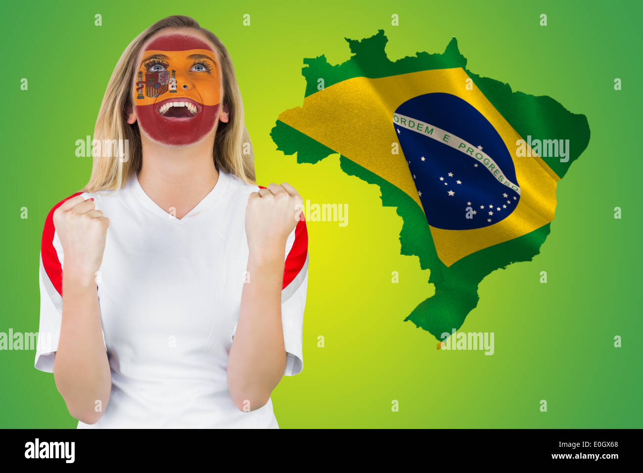 Excited spain fan in face paint cheering Stock Photo - Alamy