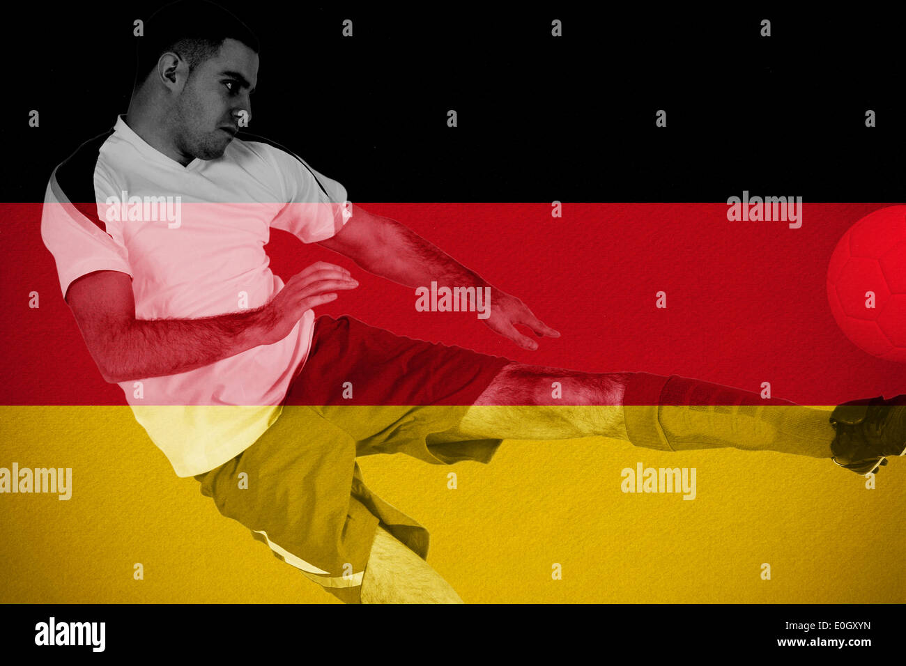 Fit football player playing and kicking Stock Photo - Alamy